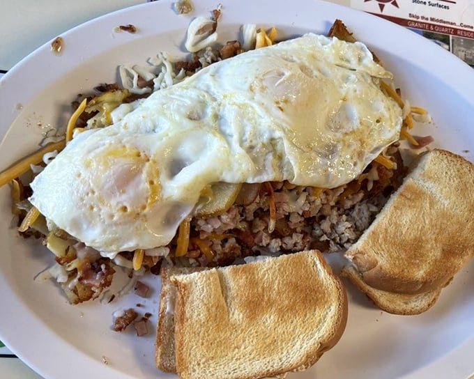 A skillet that means business&mdash;perfectly cooked eggs atop a foundation of potatoes and meat that turns breakfast into an adventure.