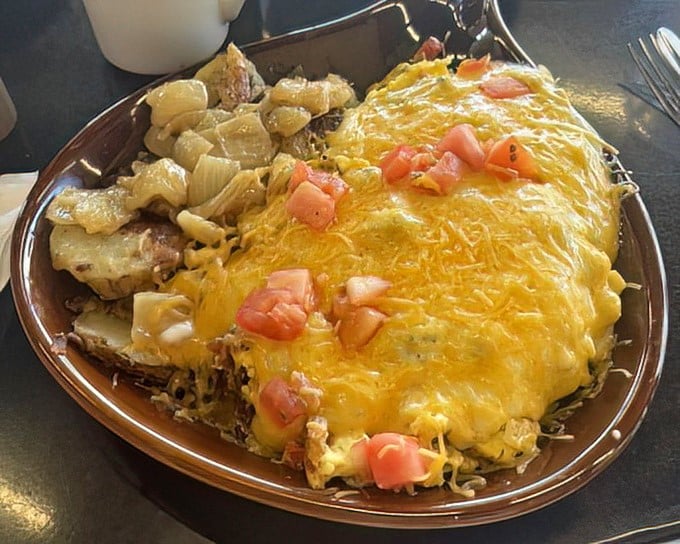This plate doesn't just feed you—it embarks on a mission to make sure no hunger survives past breakfast, with cheese melted to golden perfection.