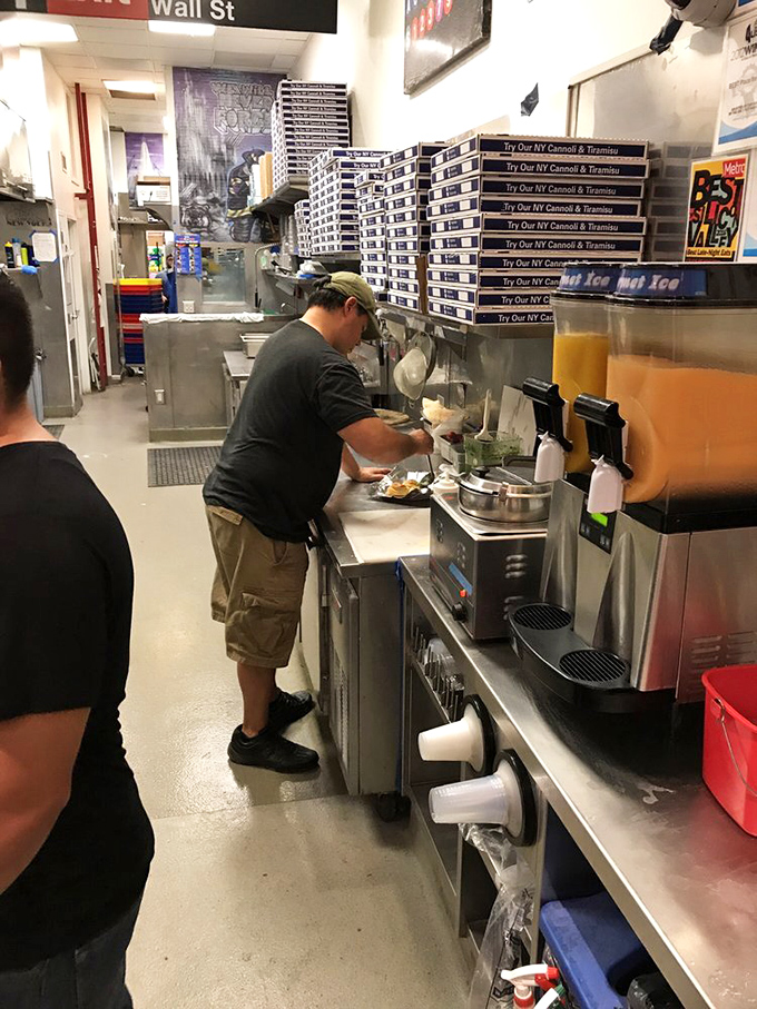 Watch the pizza artisans work their magic, transforming simple ingredients into edible works of art.