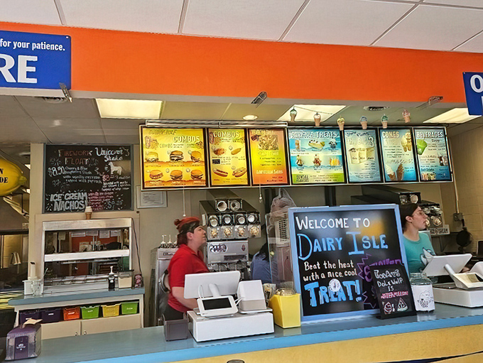 Behind the counter, where island magic happens&mdash;soft serve machines whirring and order screens glowing with promised delights.