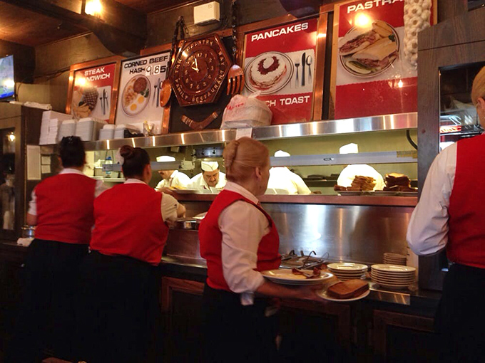 The kitchen pass&mdash;where red-vested servers transform into plate-balancing magicians, orchestrating the breakfast ballet that keeps hungry patrons happy.