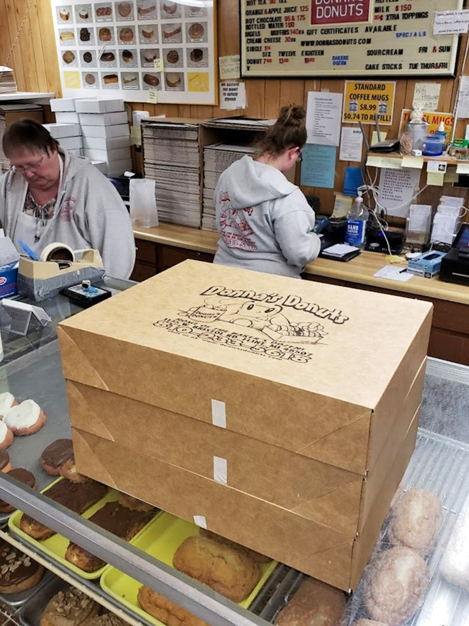 The friendly faces behind the magic, proving that great donuts require even greater people.