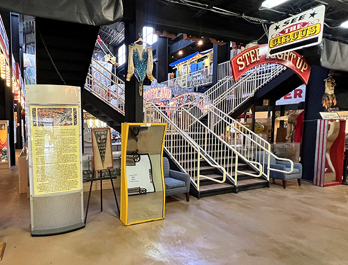 Carnival stairs lead visitors on a journey through exhibits showcasing the artistry behind traveling show business magic.