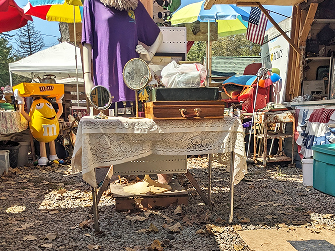 The tablecloth transforms ordinary folding tables into elegant retail establishments&mdash;just add one yellow M&M figurine for that touch of surreal charm.