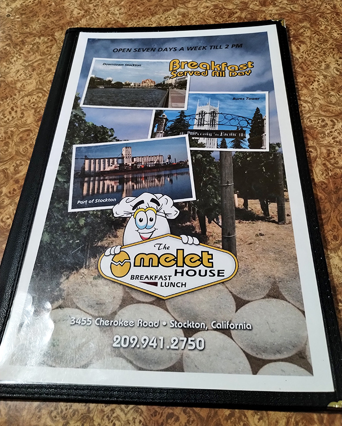 The menu cover showcases Stockton landmarks alongside their egg mascot&mdash;local pride served with a side of breakfast charm.