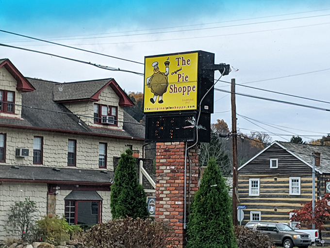 The cheerful yellow sign acts as a beacon of hope for the hungry traveler &ndash; like a lighthouse, but instead of safe harbor, it guides you to pie.