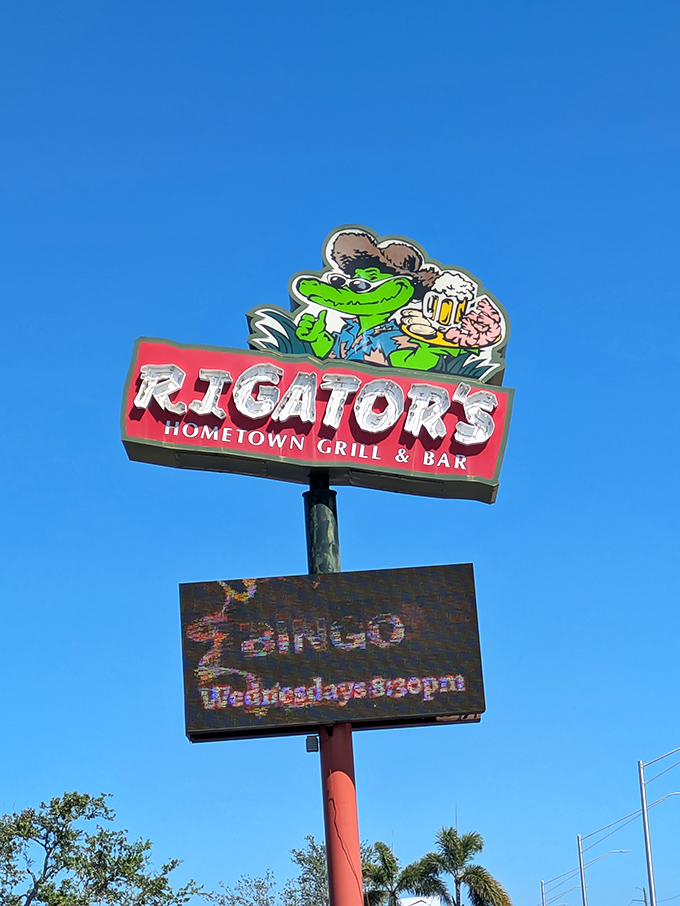 The cartoon gator on the sign holds a beer like he's your drinking buddy, not your dinner. Florida marketing at its finest.