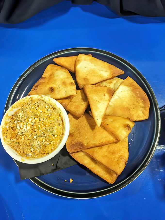 These aren't your average chips and dip&mdash;they're crispy vessels for a golden treasure that demands to be scooped with enthusiasm.