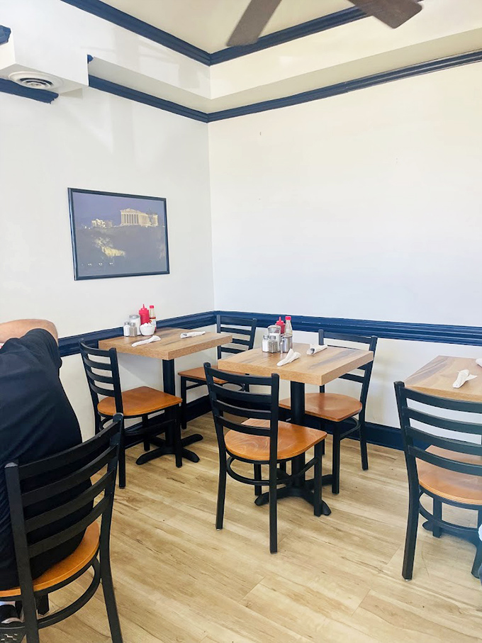 The dining area's clean blue and white palette with wooden tables isn't designed for Instagram&mdash;it's designed for the serious business of enjoying breakfast without distractions.