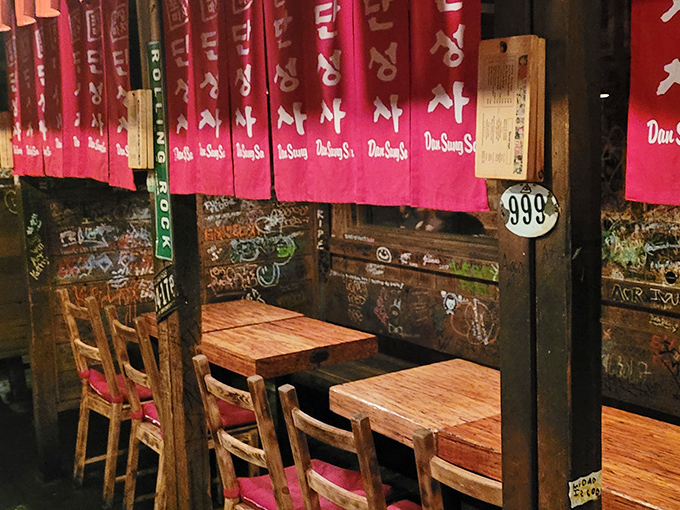 Those "999" markers and bright red banners aren't just decor—they're portals to authentic Korean pojangmacha culture, right in the heart of Los Angeles.