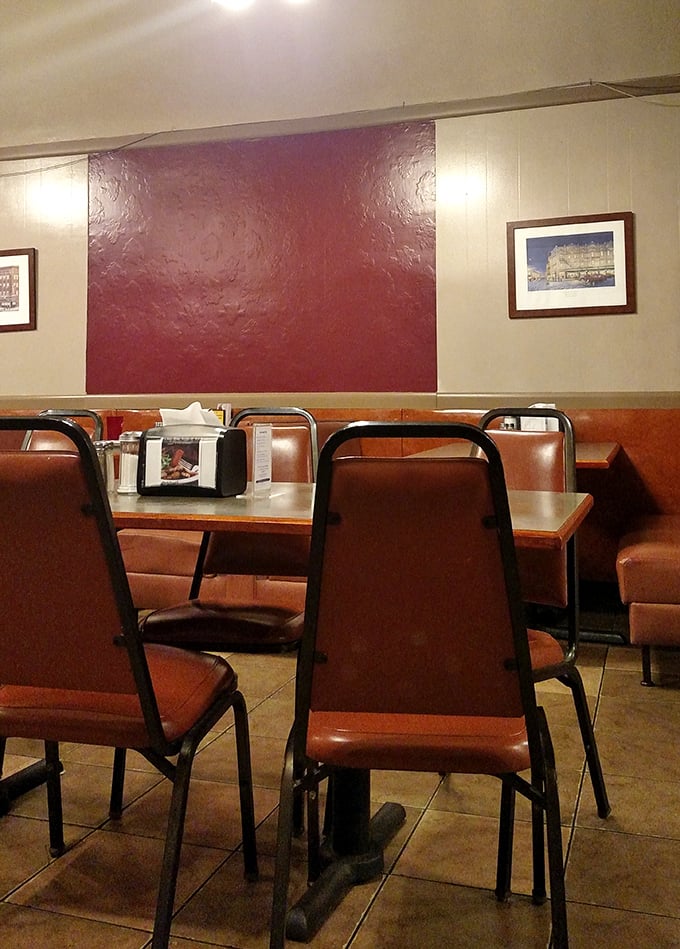 Burgundy walls and simple furnishings create that "been here forever" vibe. The kind of place where your grandparents might have had their first date.