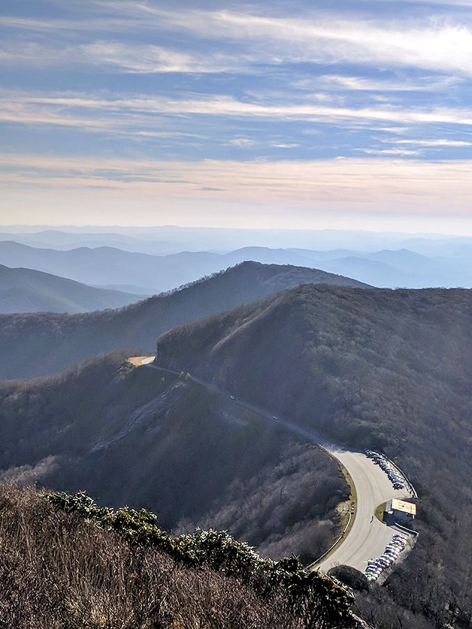 The serpentine Blue Ridge Parkway curves gracefully through the mountains, looking like a ribbon casually tossed across nature's gift box.