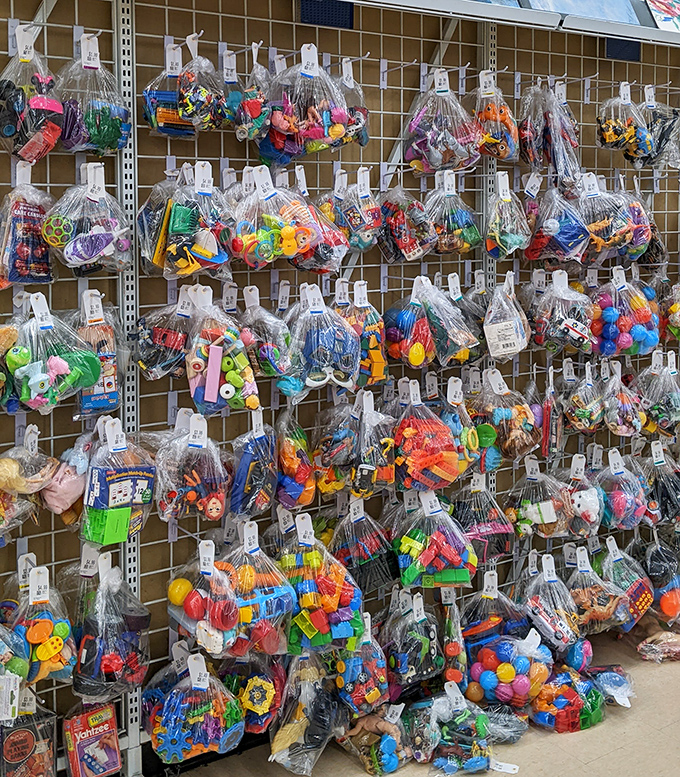 Toy bundles hanging like colorful pi&ntilde;atas&mdash;plastic joy suspended in mid-air, waiting for small hands and big imaginations.