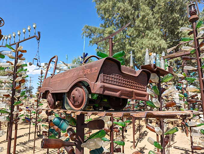 A miniature car perched high above proves that scale doesn't matter when imagination is your primary building material.