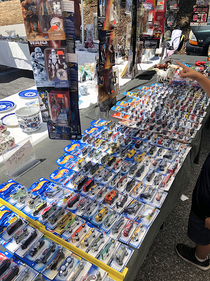 Star Wars figures stand at attention next to vintage Hot Wheels. Childhood nostalgia has never been so perfectly arranged in plastic clamshells.