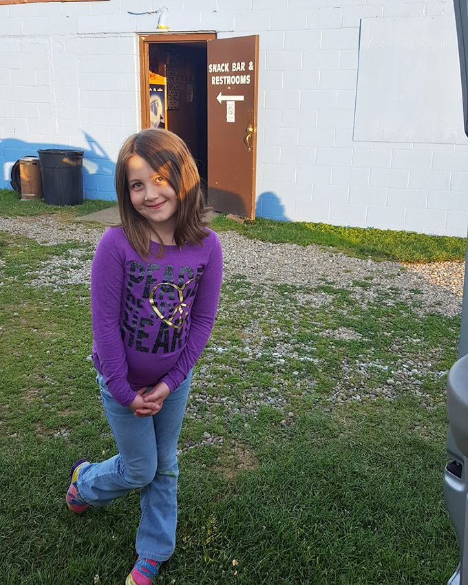 Young visitors discover the magic of drive-in theaters for the first time. That smile says she's creating memories that will last a lifetime.