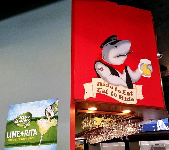 "Ride to Eat, Eat to Ride"&mdash;words to live by from a shark in a captain's hat. This whimsical wall art captures the Shrimp Shack's playful spirit. 