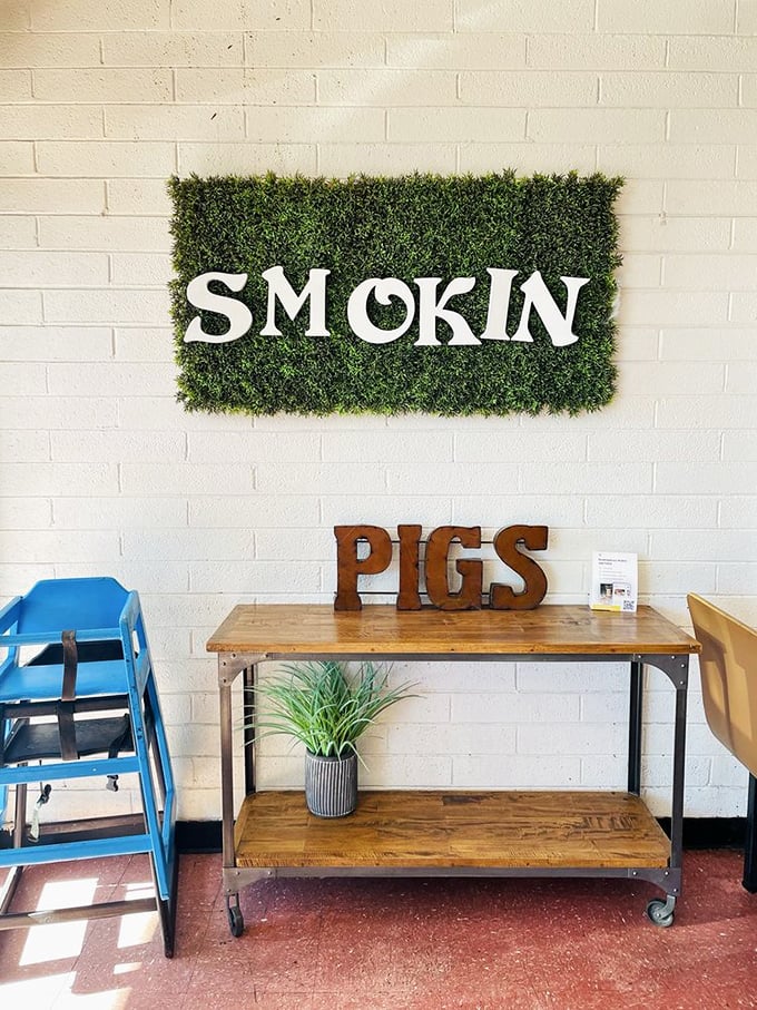 Smokin' Pigs wall art that tells you everything you need to know about their priorities. No mixed messages here.