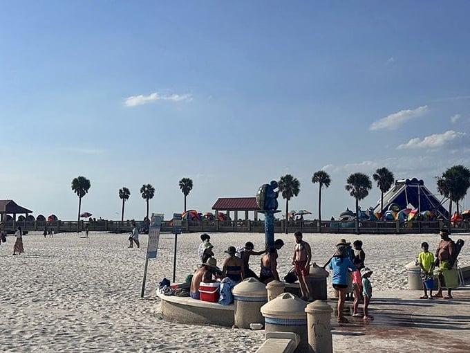 The unofficial gathering spot where beachgoers rinse away sand while exchanging tips on the best local seafood spots and sunset viewing positions.