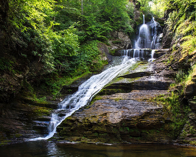 Water dancing down ancient rock faces creates a multi-tiered masterpiece. Nature's version of a spa day, minus the cucumber water and hefty bill.