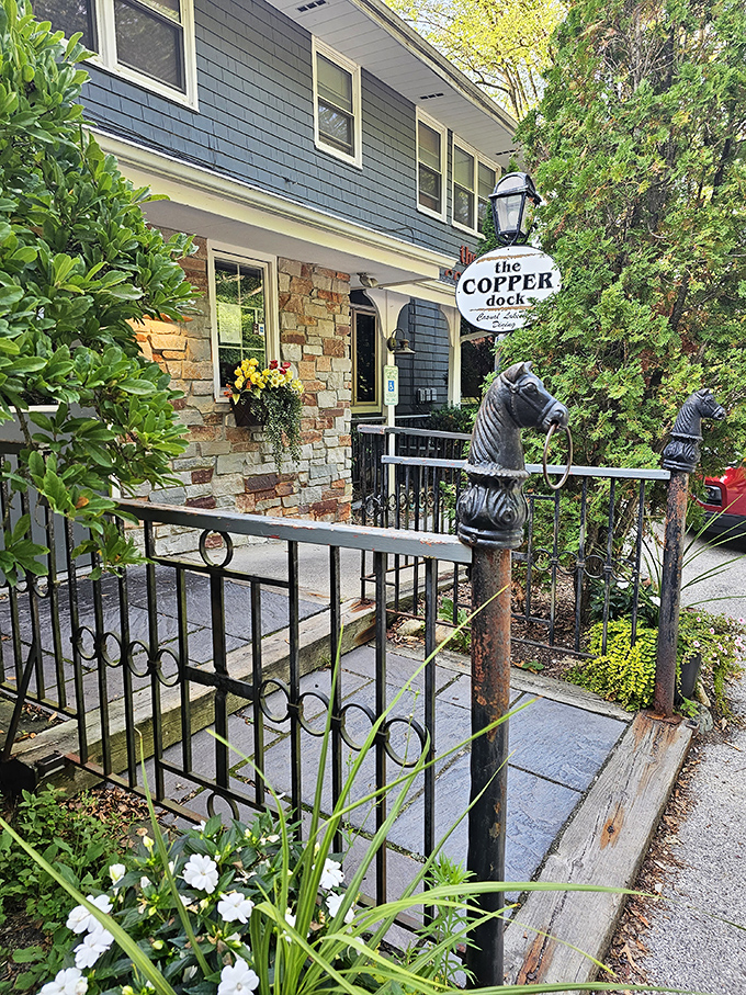 Stone pathways and welcoming entrance details hint at the culinary treasures waiting inside this beloved Hubertus destination.