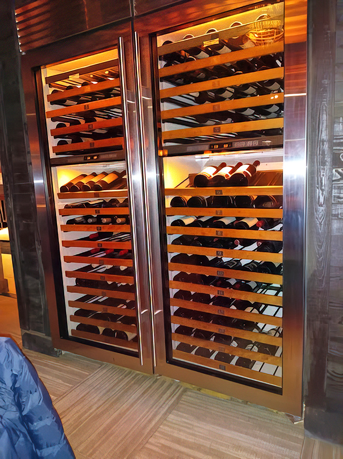 This wine display isn't just storage&mdash;it's a temperature-controlled temple to fermented grapes that would make any oenophile weak in the knees.