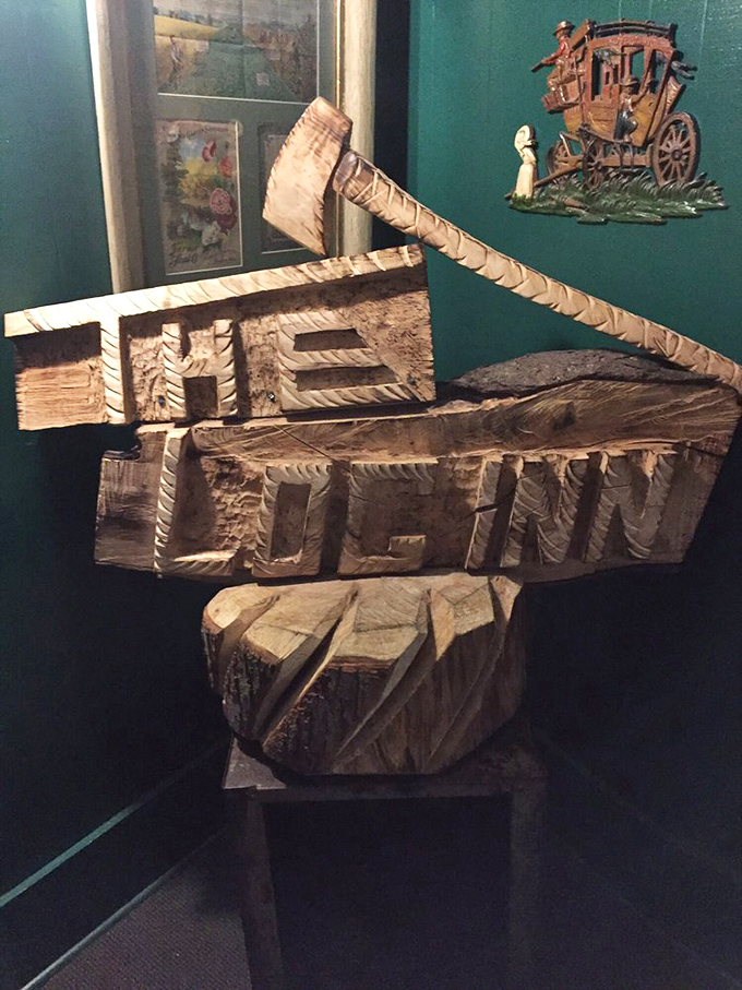 A wooden carving proudly announcing "THE LOG INN" &ndash; because sometimes the most meaningful art isn't in museums, it's in restaurants.
