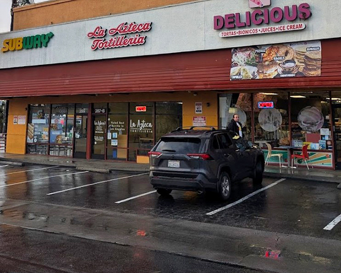 La Azteca Tortilleria's colorful storefront brings a slice of Mexico to East LA, promising handmade tortilla perfection.