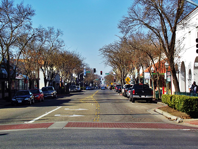 Morning in Merced reveals wide, welcoming streets where palm trees and historic buildings create that distinctly California small-town vibe.