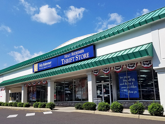 The welcoming storefront with patriotic bunting invites shoppers to find treasures while supporting a good cause.