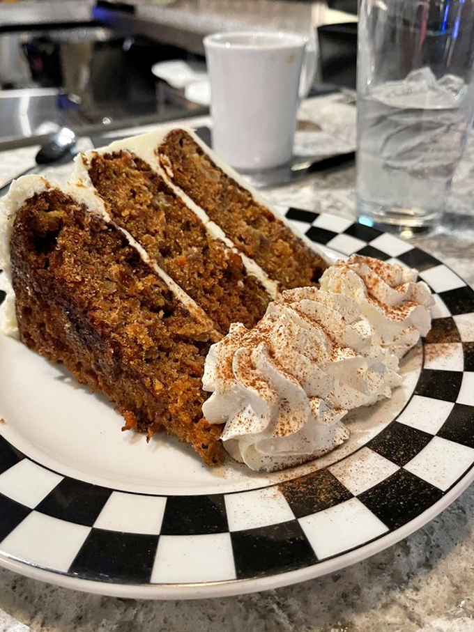 The 24K Carrot Cake&mdash;moist, spiced perfection with cream cheese frosting that makes you understand why people used to trade spices for gold.