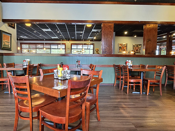 The dining room's blue wainscoting and honey-colored tables create that perfect "fancy enough for a celebration, casual enough for Tuesday" vibe.