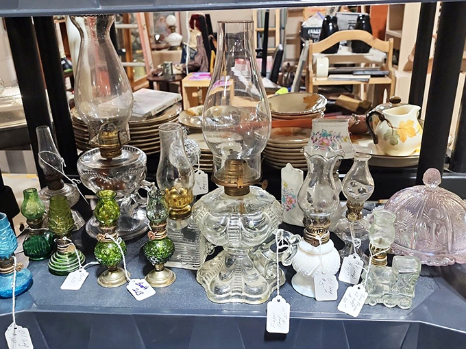 Illumination artifacts that once lit homes across America. These oil lamps cast a glow on history, each glass base and chimney a testament to practical beauty.