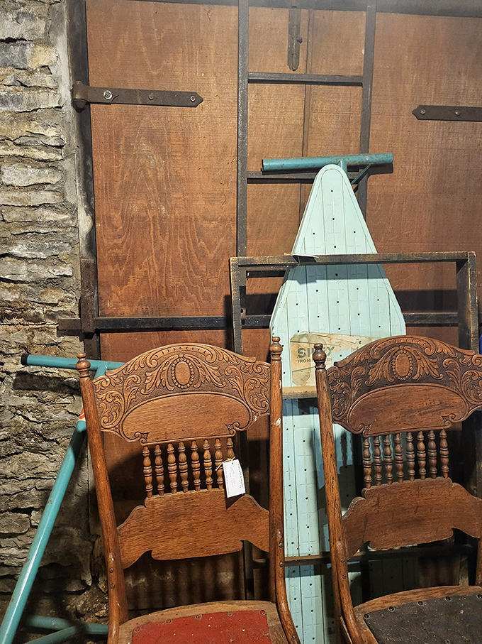 Carved headboards tell tales of craftsmanship from another era. That turquoise ironing board adds the perfect pop of unexpected color.