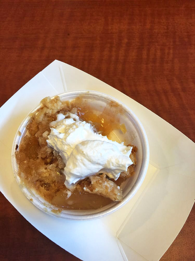 Apple cobbler topped with whipped cream&mdash;because after all that savory, your sweet tooth deserves its moment in the spotlight too.