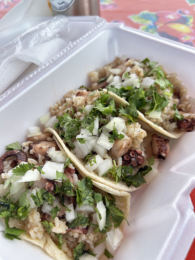 Octopus tacos that prove eight arms are better than two. Tender pieces nestled with rice and topped with the holy trinity: cilantro, onion, lime.