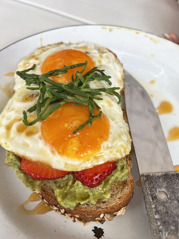Avocado toast that Instagram was invented for. Sunny eggs, strawberries, and drizzled honey create a breakfast worth getting out of bed for.