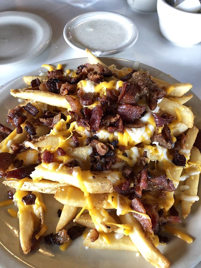 Bacon cheese fries that transform a simple side dish into the kind of indulgent treat dreams are made of.