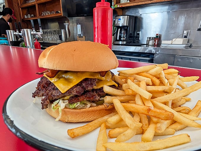 This isn't some dainty, deconstructed gourmet creation—it's a proper burger with cheese melting just right and fries crisp enough to make you weep.