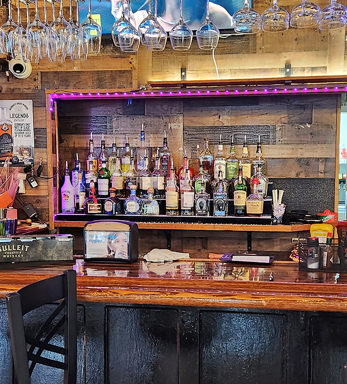 This isn't just a bar&mdash;it's command central for liquid happiness. The purple lighting adds a touch of royalty to your drinking experience.