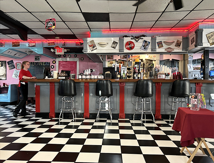 The bar stools stand at attention, ready for solo diners who know counter service often comes with the best conversations and unobstructed views of culinary magic.
