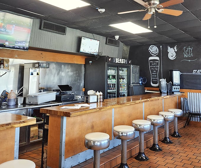 Classic diner-style seating at the bar offers front-row seats to the barbecue show. Those stools have witnessed countless food epiphanies.