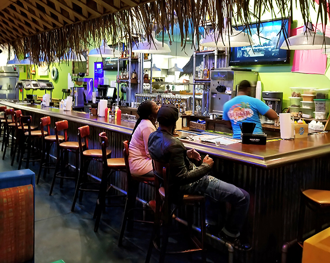 Where everybody knows your order! The casual bar seating offers front-row views of culinary magic happening in the kitchen.