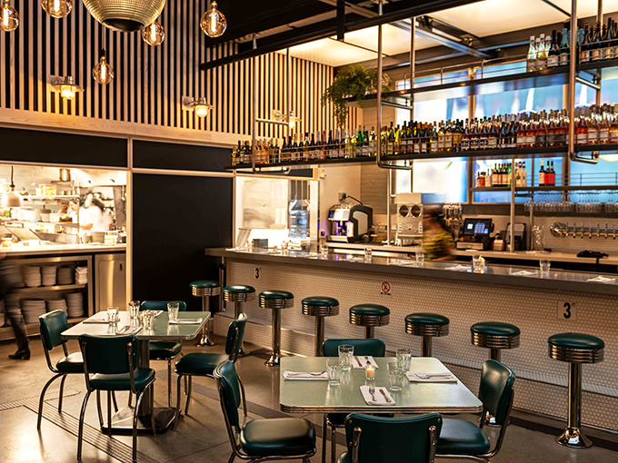 Counter seating offers front-row tickets to the culinary show, where every plate becomes a performance worth watching.