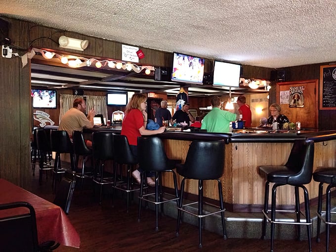 The horseshoe bar offers front-row seats to Wisconsin's favorite spectator sport: watching skilled bartenders craft the perfect old fashioned.