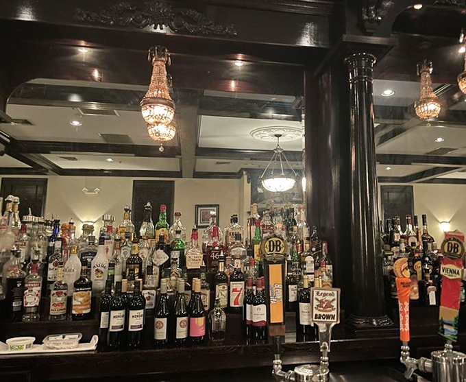 A bar selection impressive enough to make a prohibition agent weep. Those crystal chandeliers have witnessed countless toasts to special occasions.