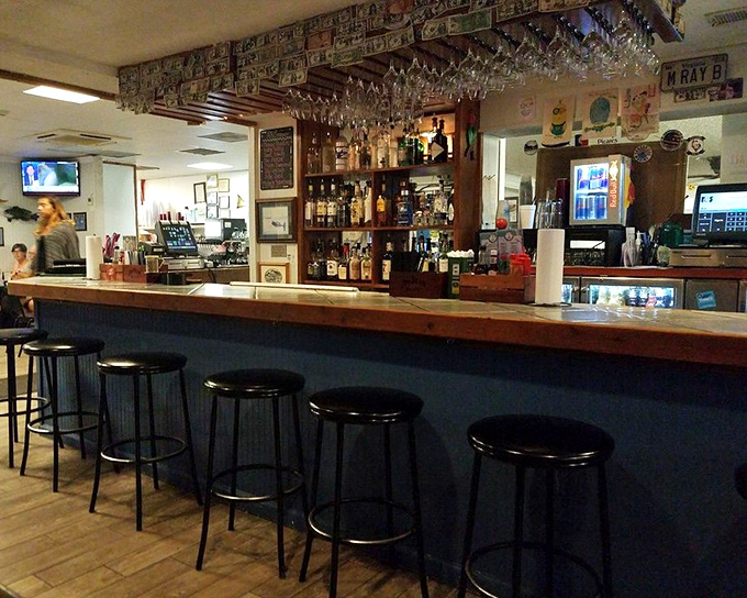 A bar that understands priorities: cold drinks, good company, and enough seafood memorabilia to start a small maritime museum.