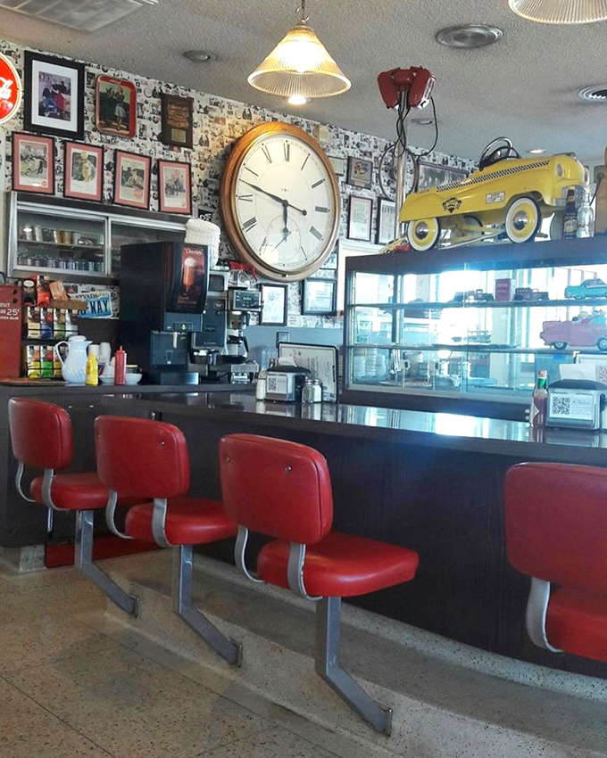 Those red counter stools aren't just seating&mdash;they're front-row tickets to the culinary show. The large clock reminds you that time tastes better here.