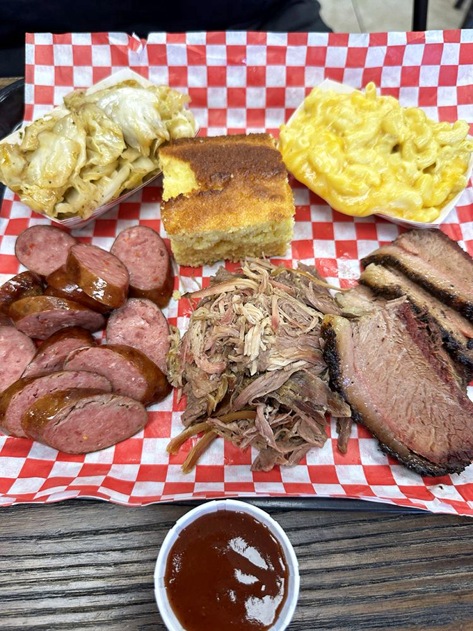 The carnivore's dream team: pulled pork, brisket, sausage, and sides that make you question why you'd ever waste stomach space elsewhere.