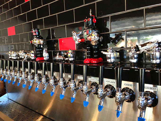 The gleaming beer taps stand ready like soldiers, with robot sentinels guarding the precious liquid gold that pairs perfectly with your burger adventure.